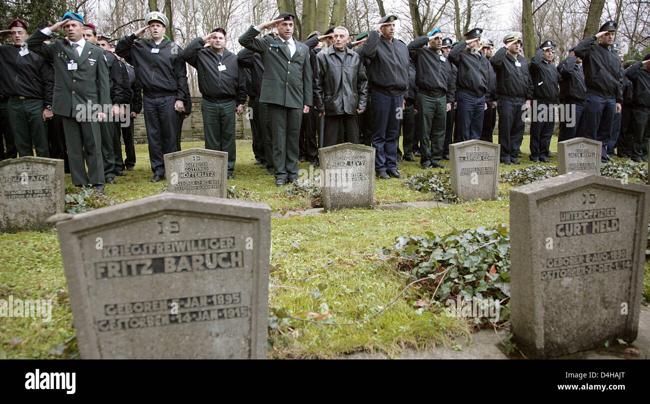 Israeli soldiers salute behind gravestones at the Jewish cemetary in ...