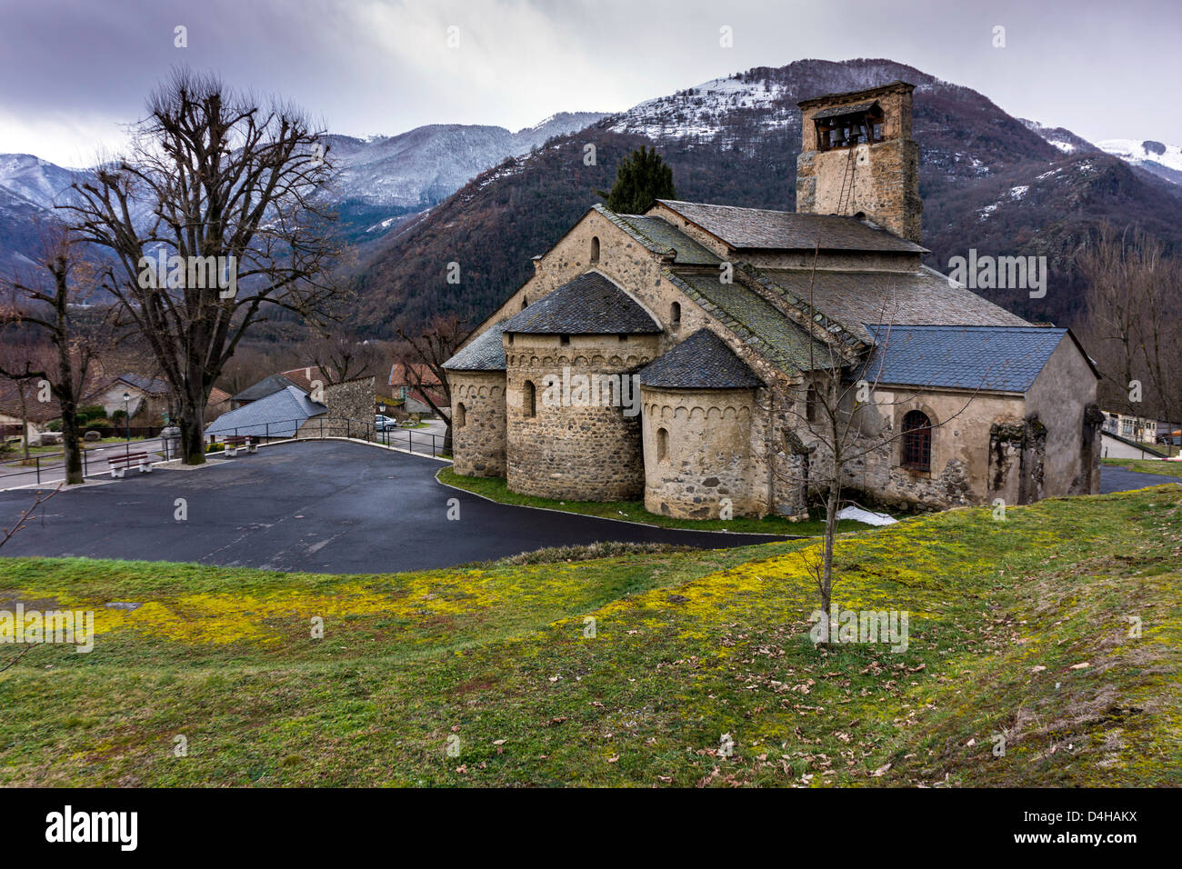 Ancient romanesque church with snowy mountains hi-res stock photography ...