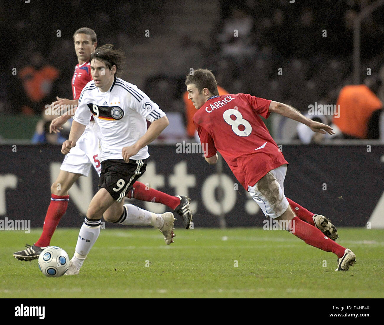 England?s Michael Carrick and Germany?s Patrick Helmes seen in action ...