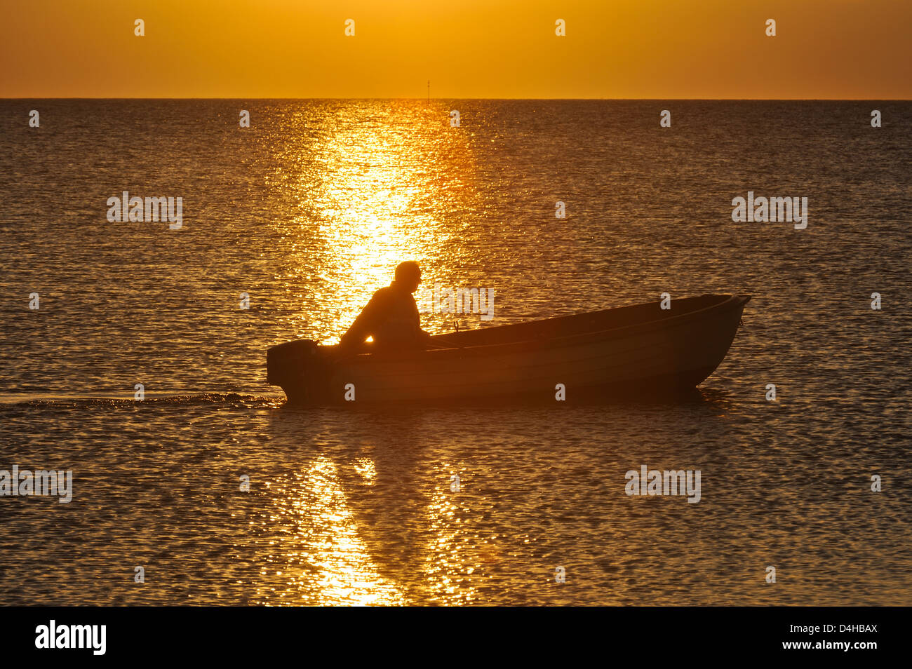 Person in boat on sea at sunset, Bua, Halland, Sweden, Europe Stock ...