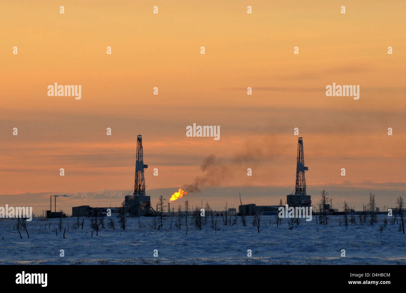 A gas flare emerges from the rig of Russian energy monopolist Gazprom ...