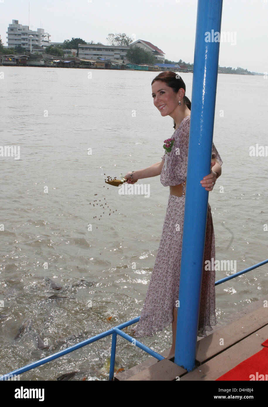 Danish Crown Princess Mary feeds fish on the floating raft on Chao ...