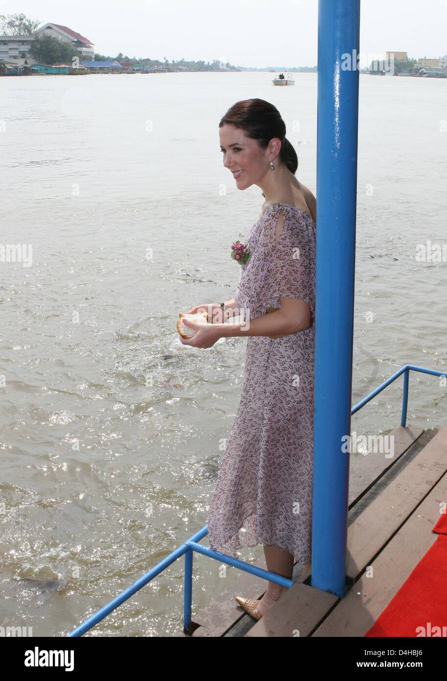 Danish Crown Princess Mary feeds fish on the floating raft on Chao ...