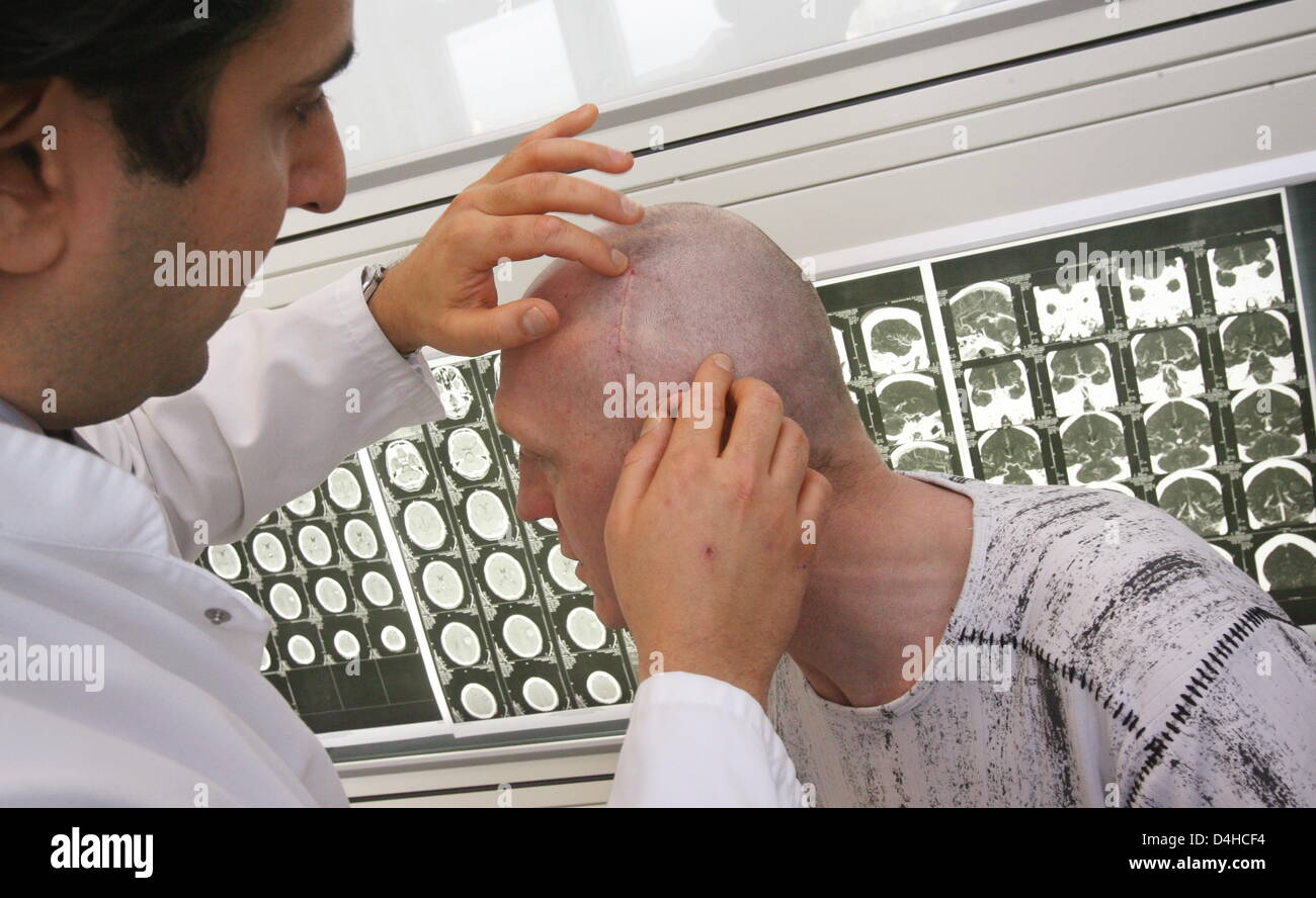 Neurosurgeon Amir Samii (L), Assistant Director of International ...