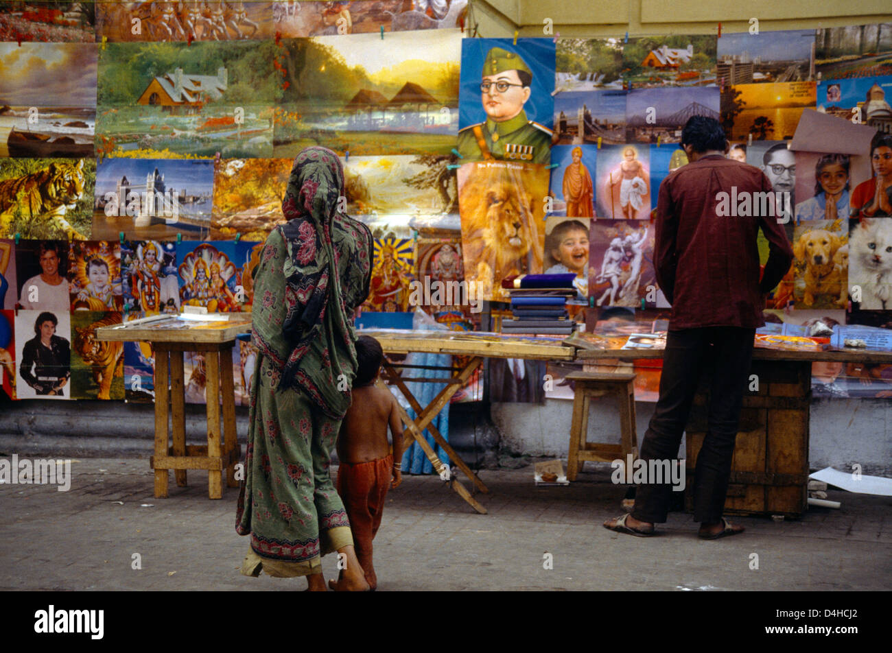 kolkata India People Looking At Posters To Buy Stock Photo - Alamy