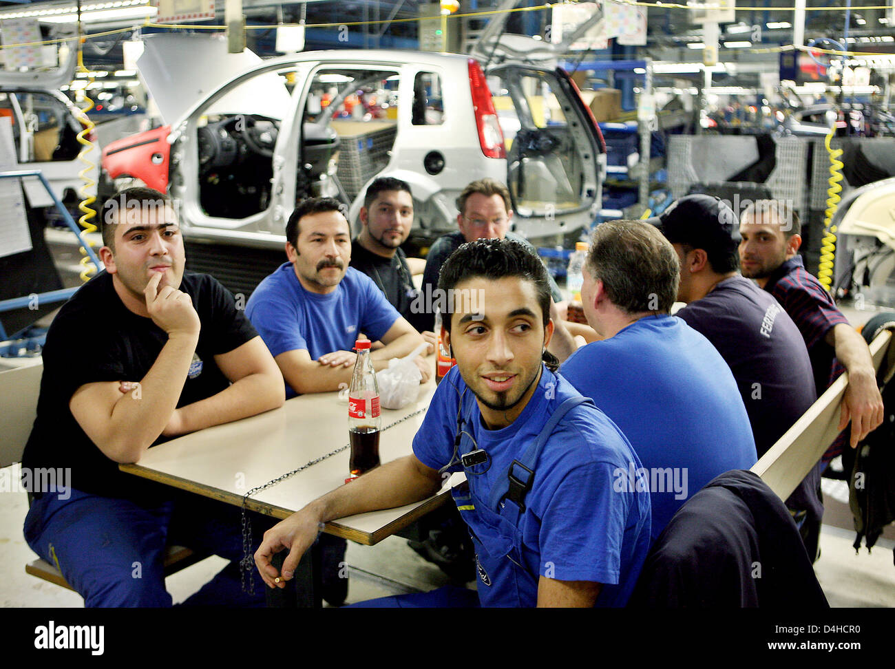 Ford workers seen during a break in front of the assembly line at the ...