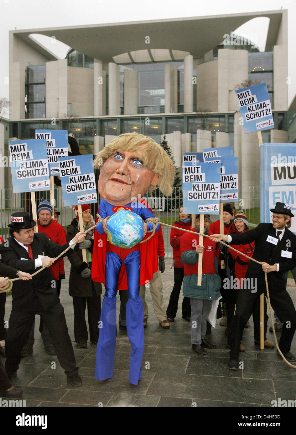 Environmental activists dressed up as energy giants and German ...