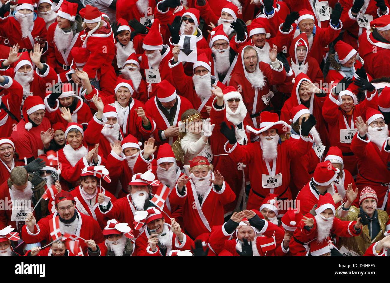 A Christ Child stands admidst Santas prior to the Santa Clause Run ...