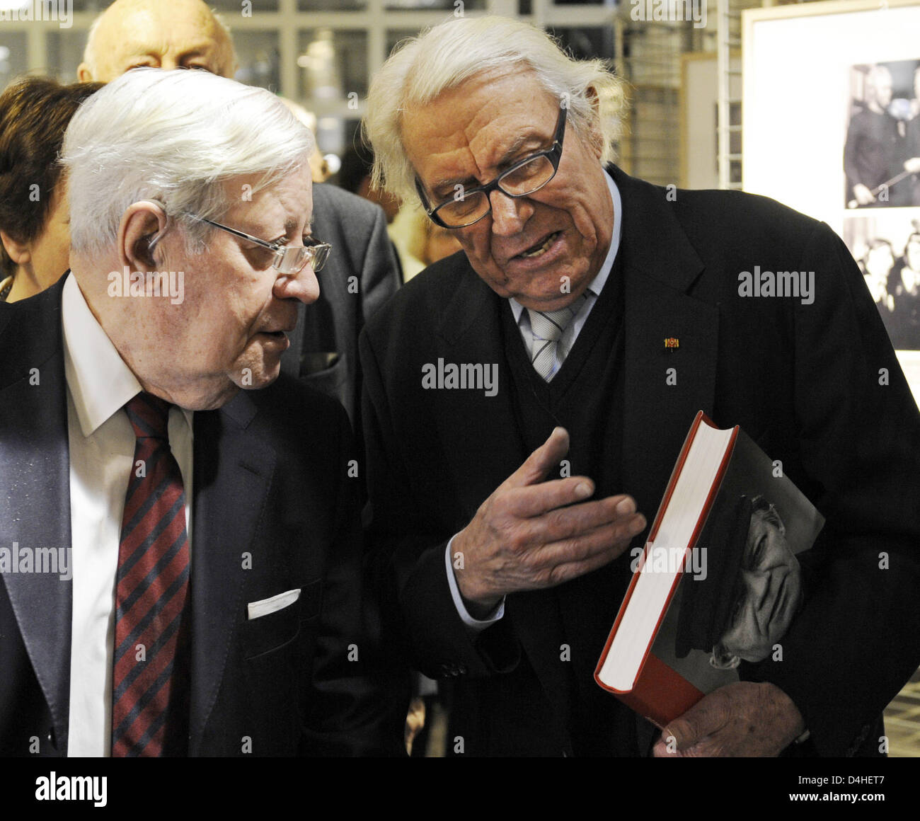 Former German Chancellor Helmut Schmidt looks at a photo exhibition ...