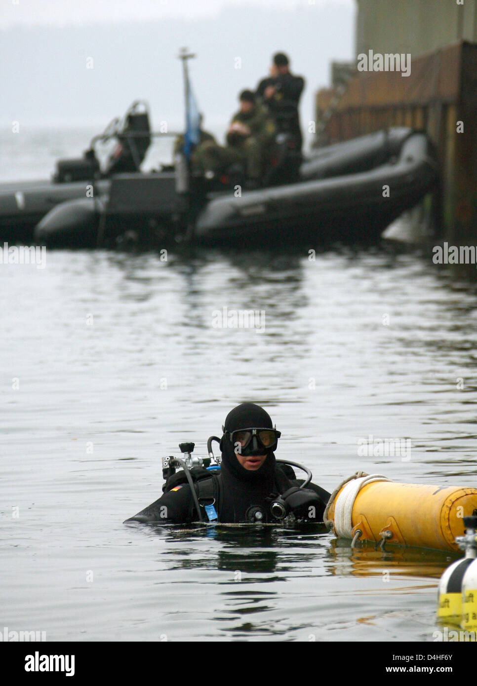 A mine diver of the German Navy prepares for a dive in the Baltic Sea ...