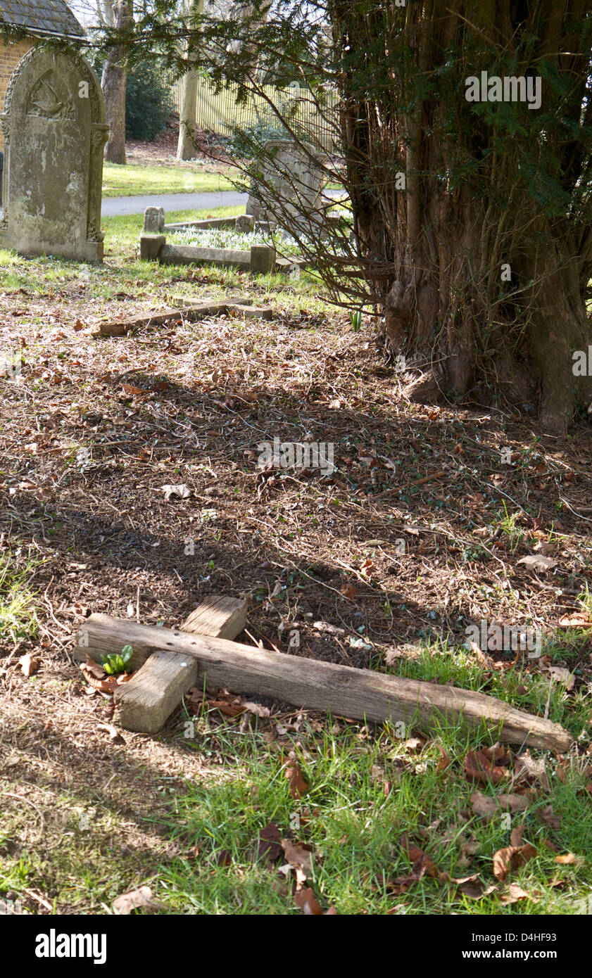 Old wooden cross lying on the ground in a churchyard Stock Photo - Alamy