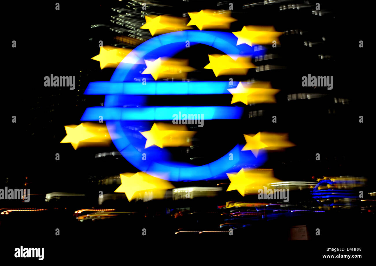 The symbol of the Europen common currency Euro seen at night in front ...