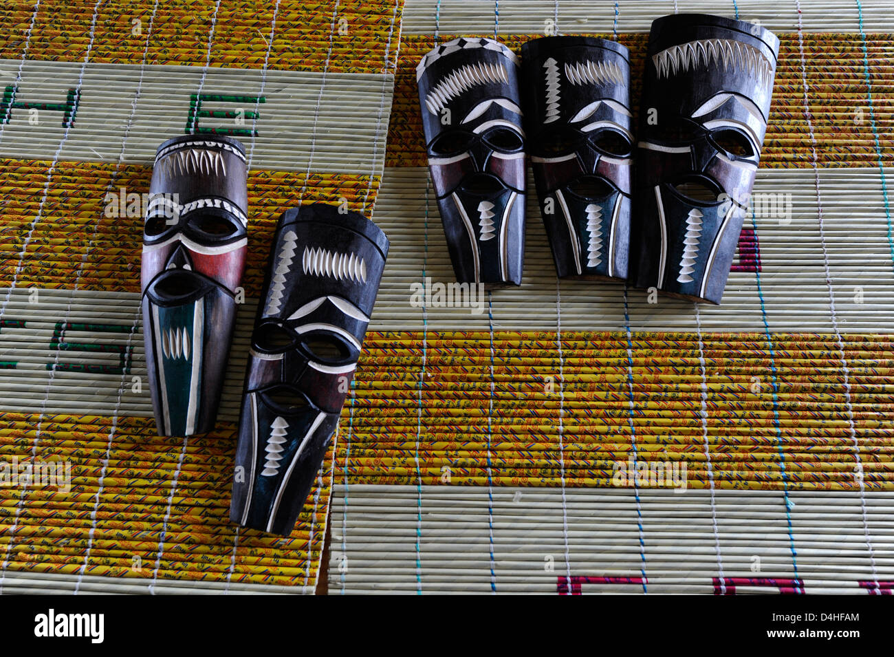 Traditional wooden masks made in manual work by children in a Zulu ...