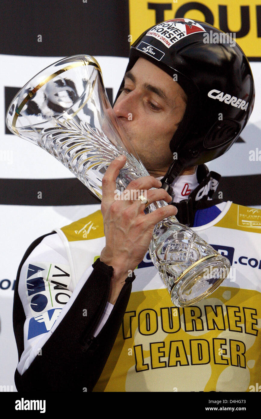Austria?s winner Wolfgang Loitz kisses the trophy for winning the third ...