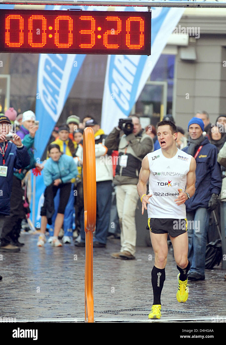 Thomas Dold, world champion in stair climbing, crosses the finish line ...