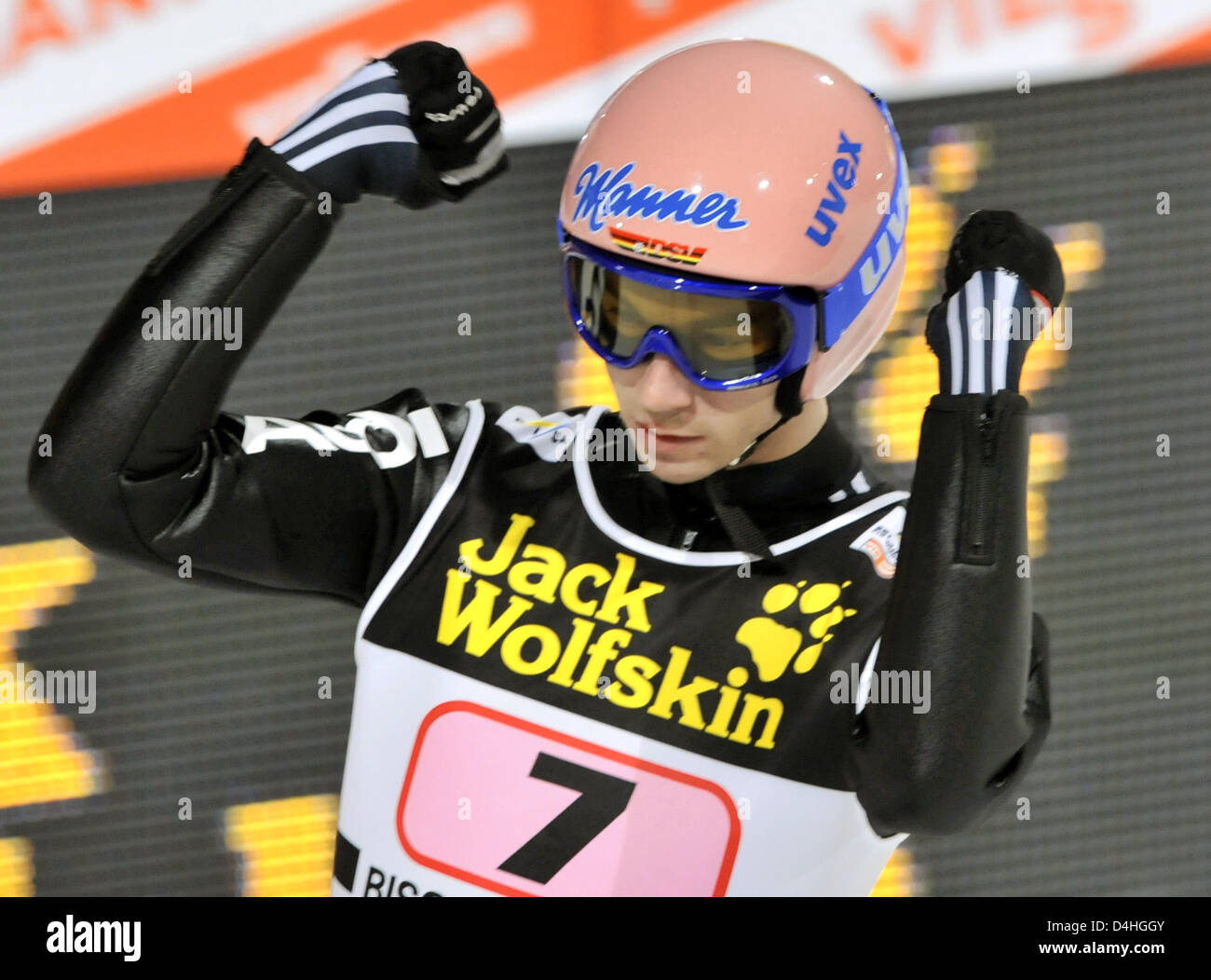 German ski jumper Michael Neumayer cheers after winning his final jump ...