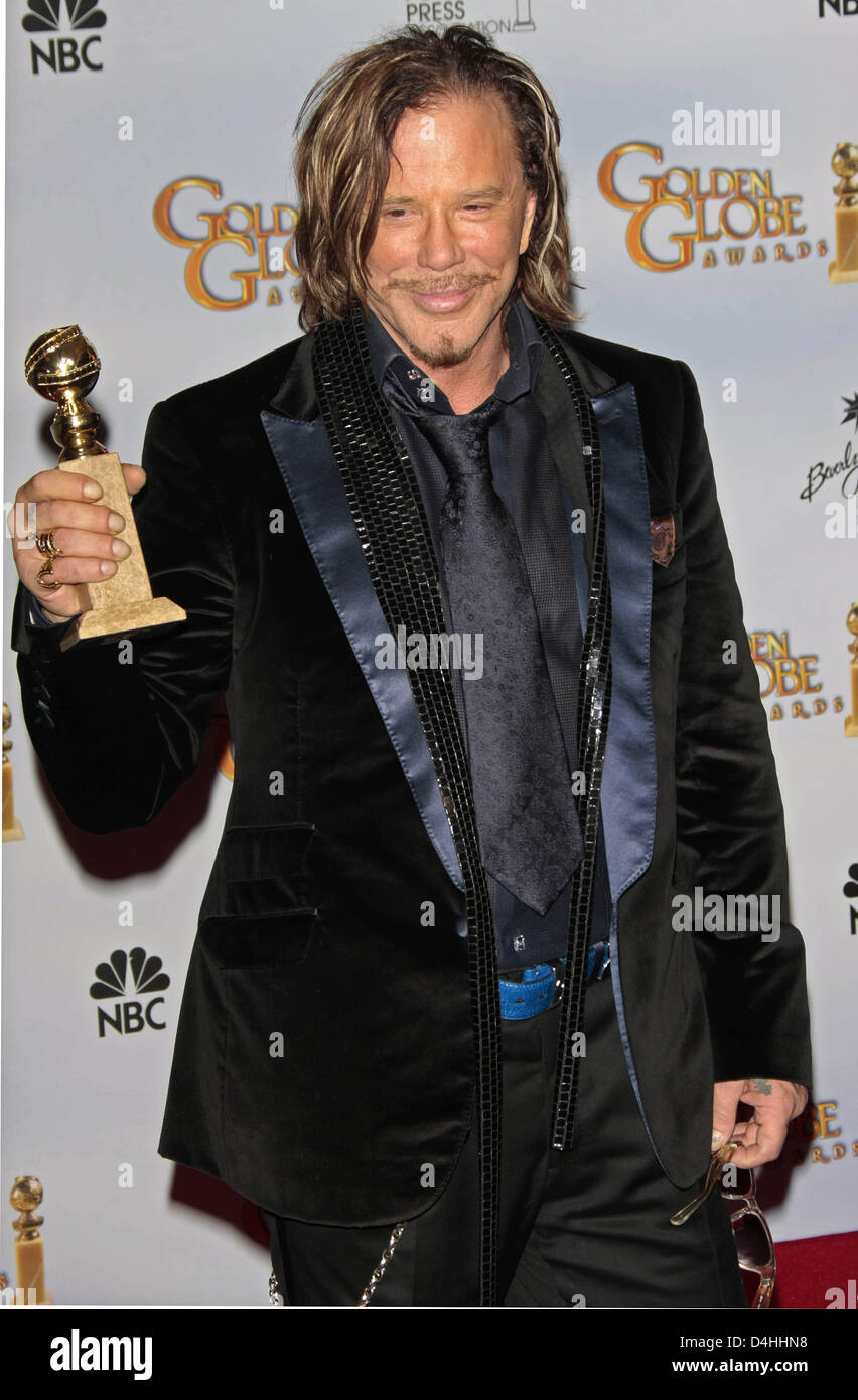 Actor Mickey Rourke poses with his award for Best Performance by an ...