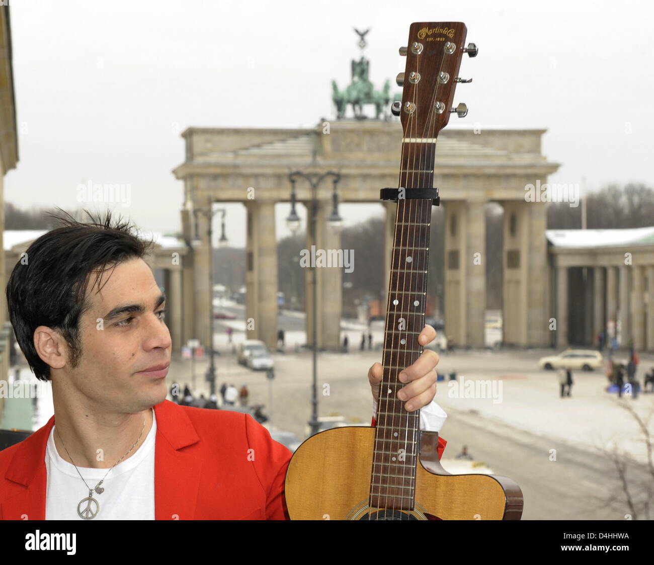Israeli singer Aviv Geffen poses with his guitar at the Brandenburg ...