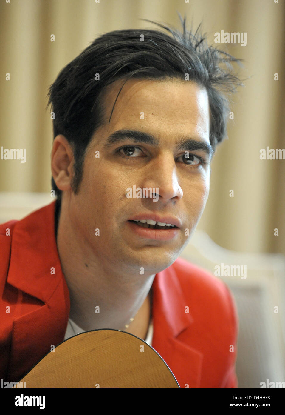 Israeli singer Aviv Geffen poses with his guitar at Hotel Adlon in ...