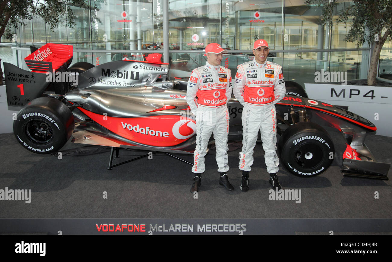 Finnish Formula One driver Heikki Kovalainen (L) and his British ...