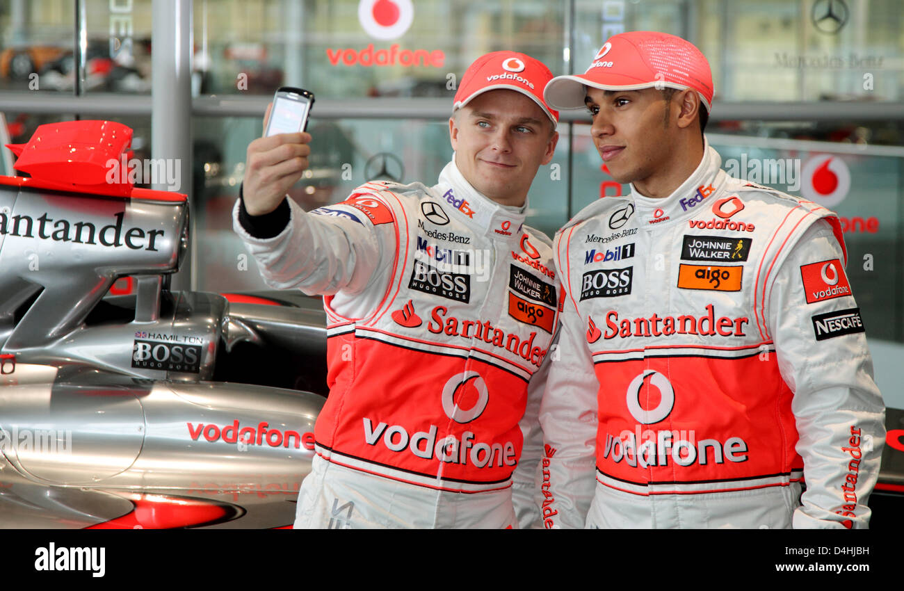 Finnish Formula One driver Heikki Kovalainen (L) and his British ...