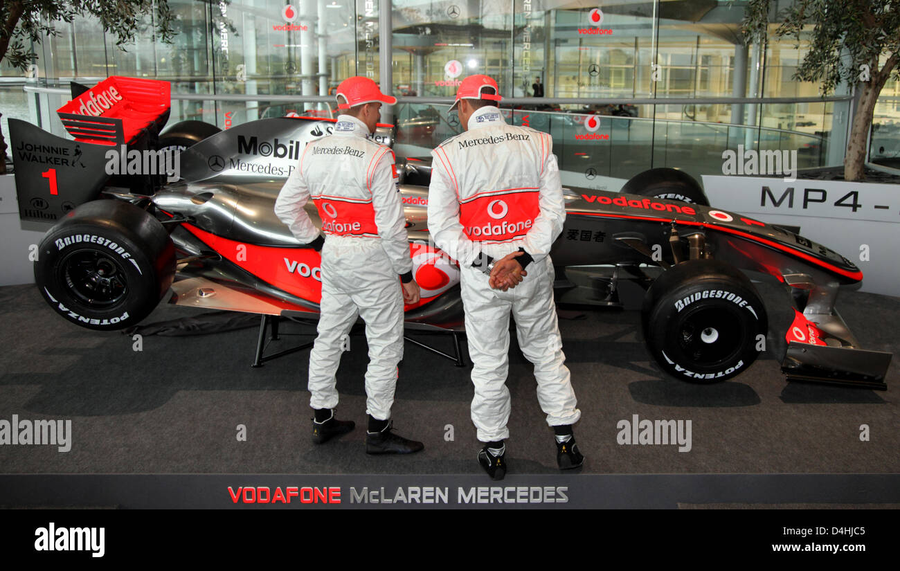 Finnish Formula One driver Heikki Kovalainen (L) and his British ...