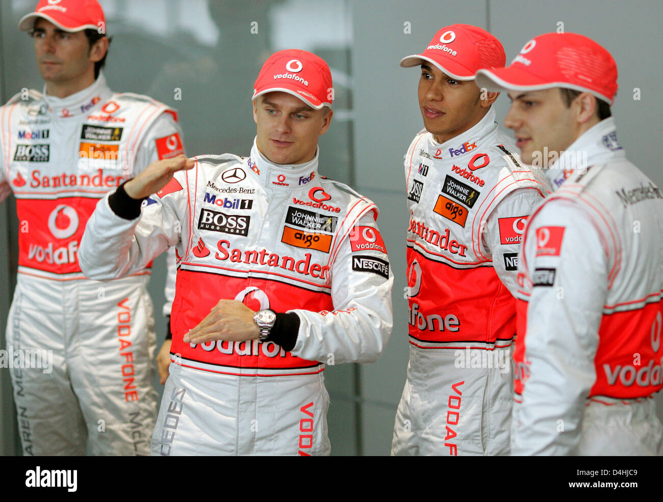 Finnish Formula One driver Heikki Kovalainen (2-L), his British ...