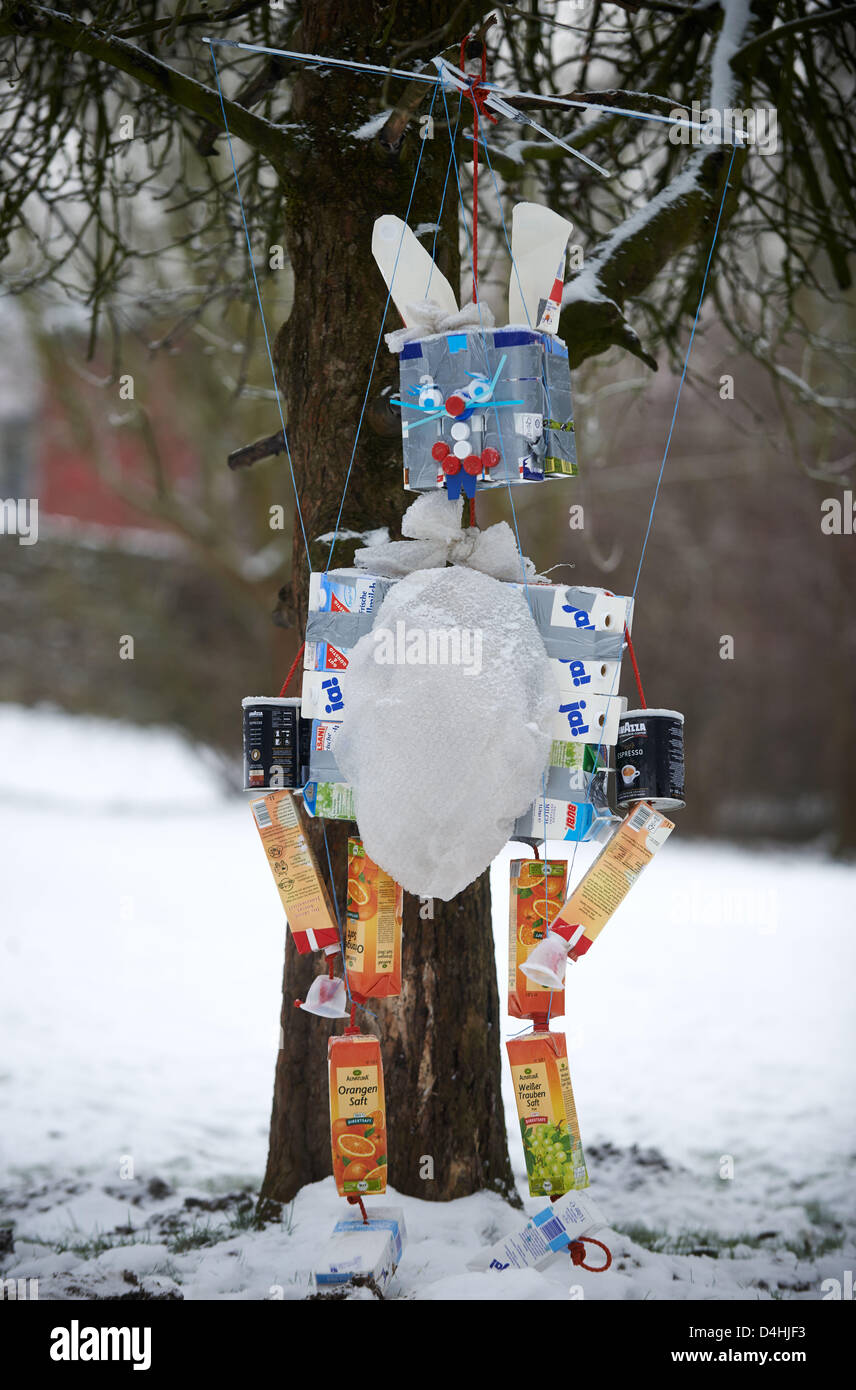 A rabbit marionette made mainly from packing trash hands in a snow ...