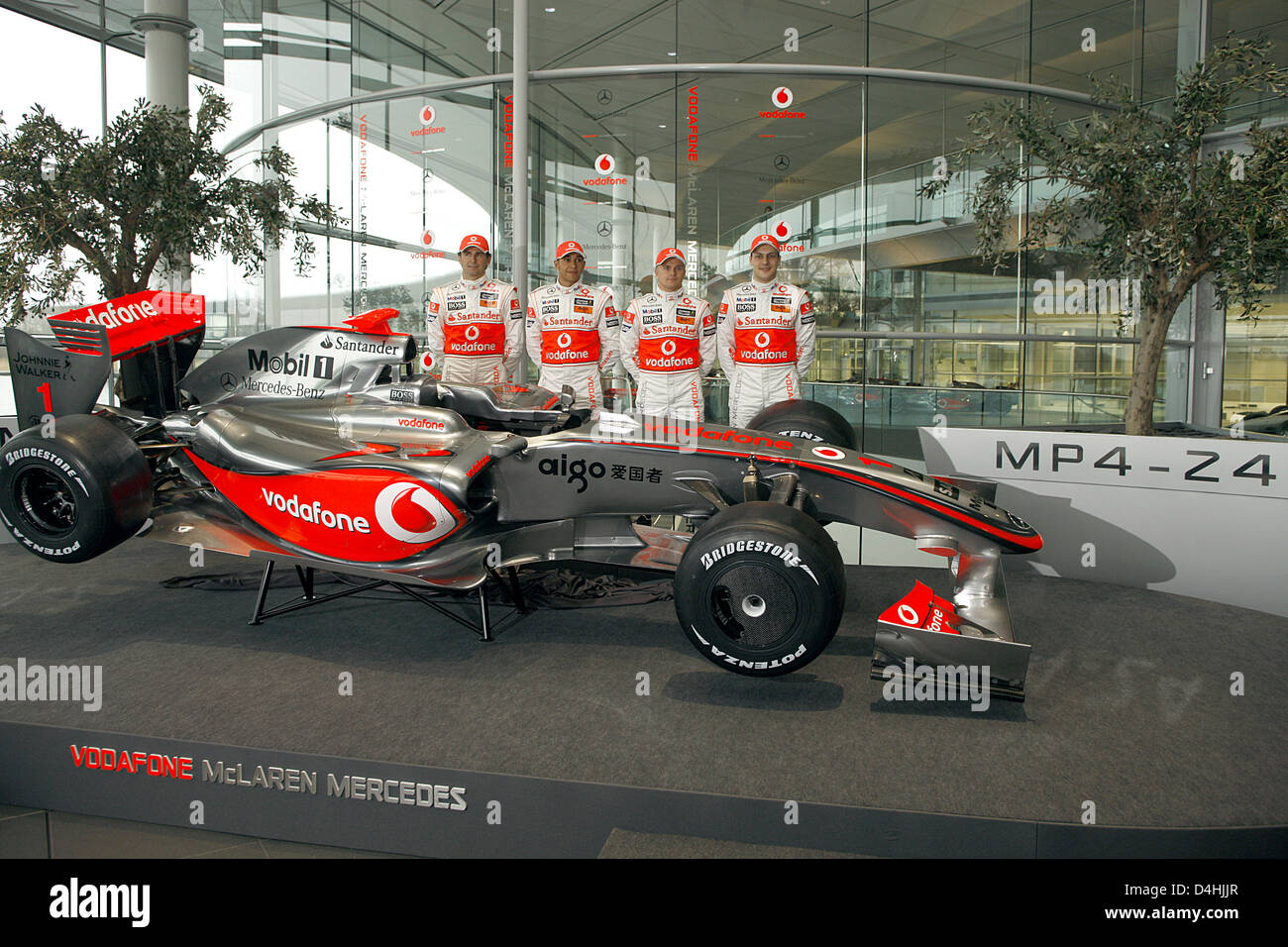 Finnish Formula One driver Heikki Kovalainen (2-R) and his British ...