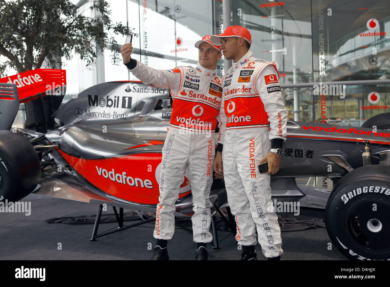 Finnish Formula One driver Heikki Kovalainen (L) and his British ...