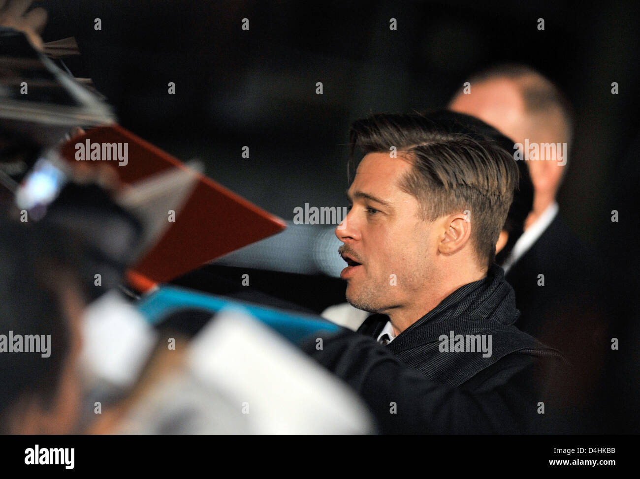 US actor Brad Pitt signs autographs on the red carpet at the German ...