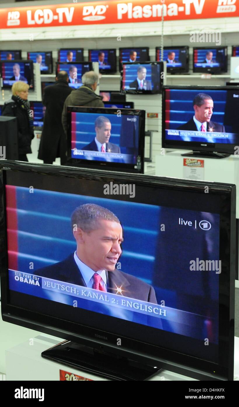 Arrays of tv screens show the swearing-in ceremony of US President ...