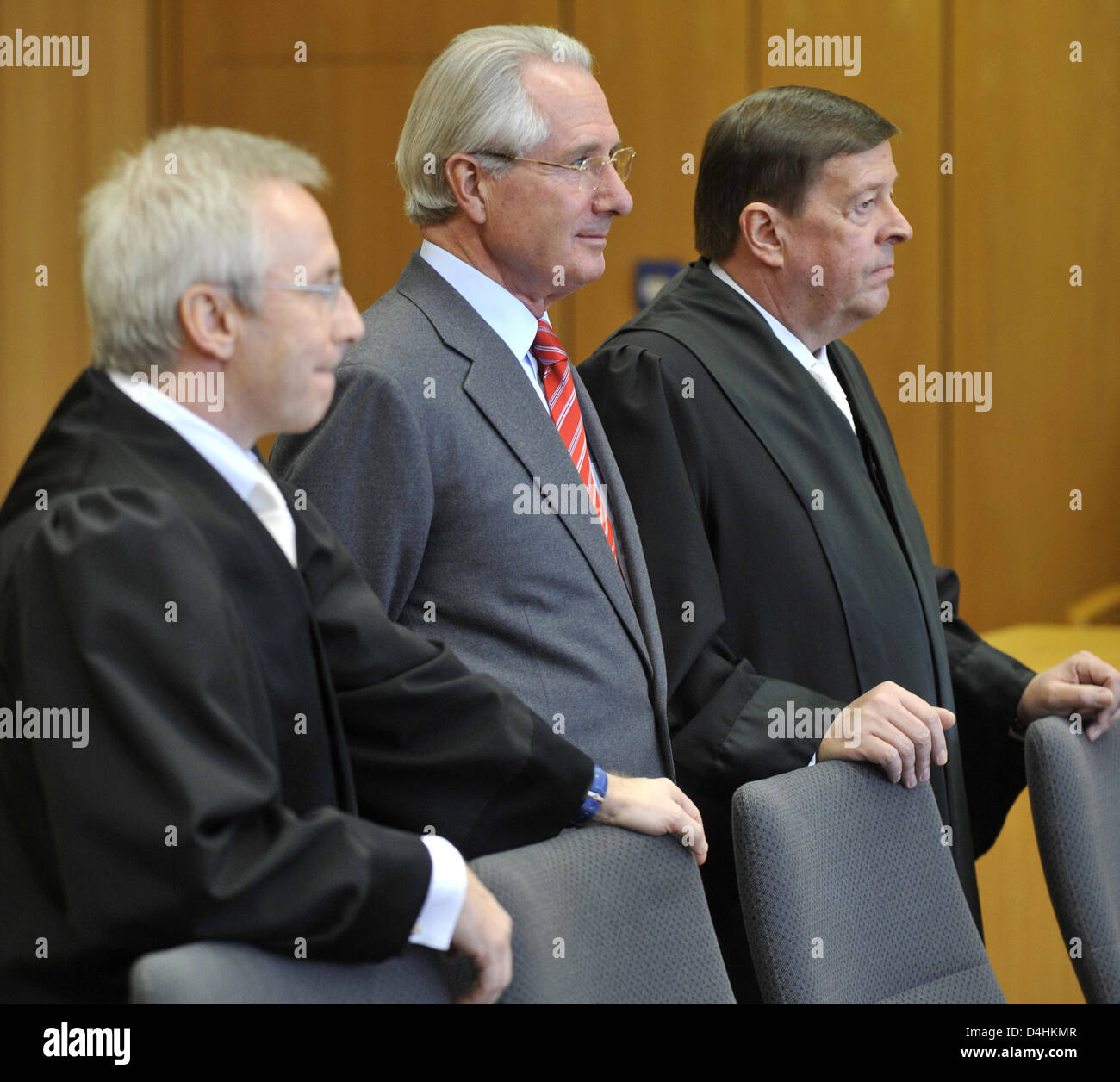 Defendant Klaus Zumwinkel (C), former CEO of Deutsche Post AG, and his ...
