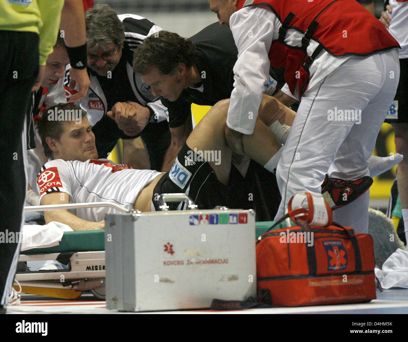 Germany?s Michael Kraus (C) is injured during the Handball World ...