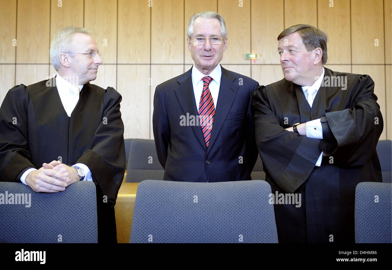 Defendant, former Deutsche Post CEO Klaus Zumwinkel (C), and his ...
