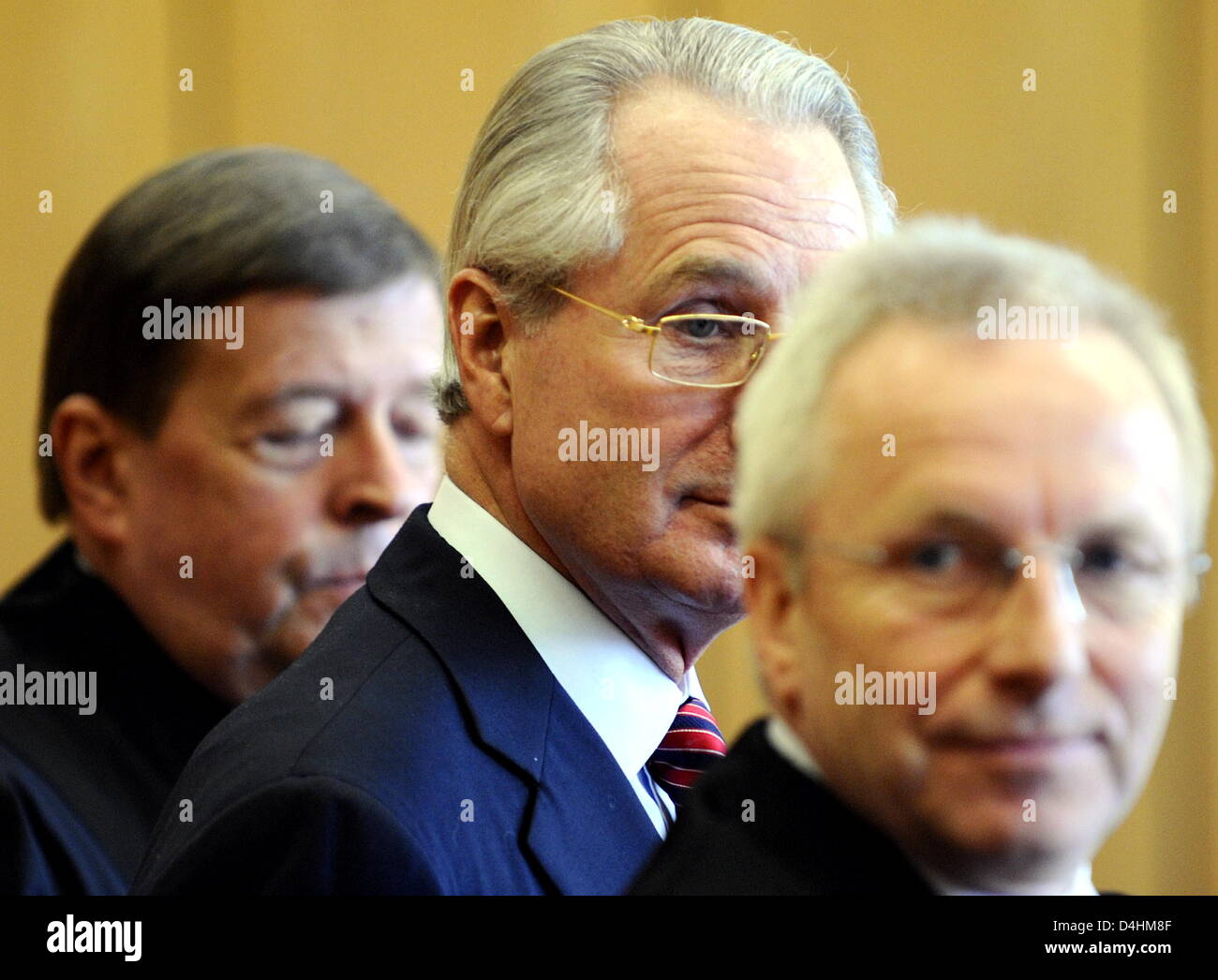 Defendant, former Deutsche Post CEO Klaus Zumwinkel (C), and his ...