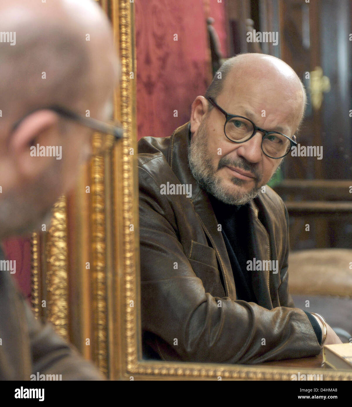 Author Martin Kluger poses for photographers prior to the conferment of ...