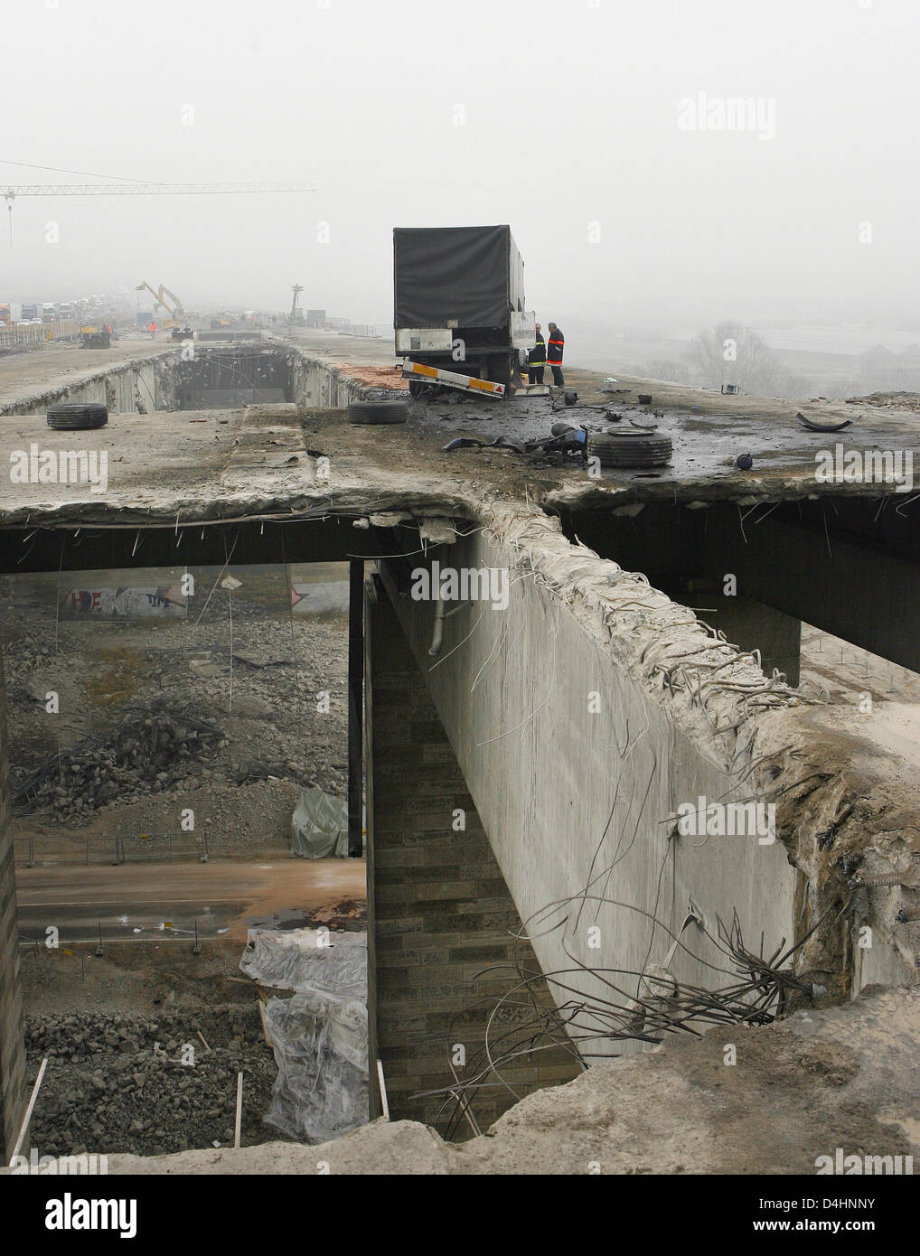 A lorry is pictured on a demolition-bridge next to motorway A3 near ...