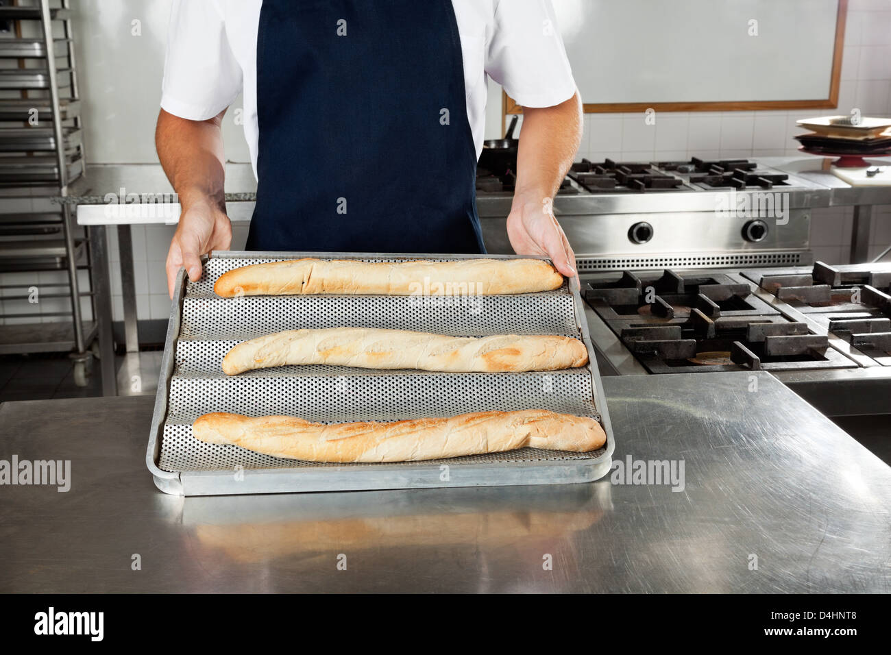 Male Chef Presenting Bread Loafs Stock Photo - Alamy