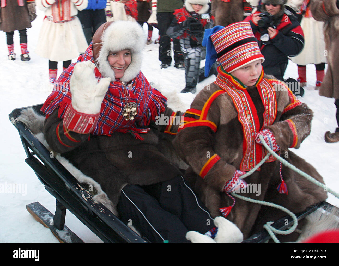 Norwegian Crown Princess Mette-Marit rides on a reindeer sleigh at a ...