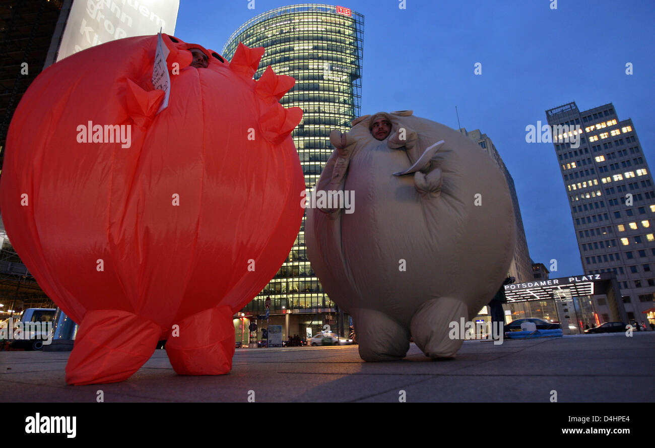 Two masqueraded men promote the film ?The Yes men fix the world? at ...