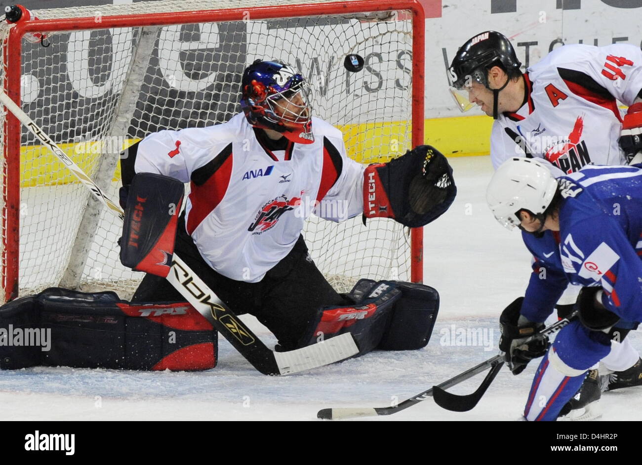 Japan?s goalkeeper Masahito Haruna (L) and Aaron Keller fight for the ...