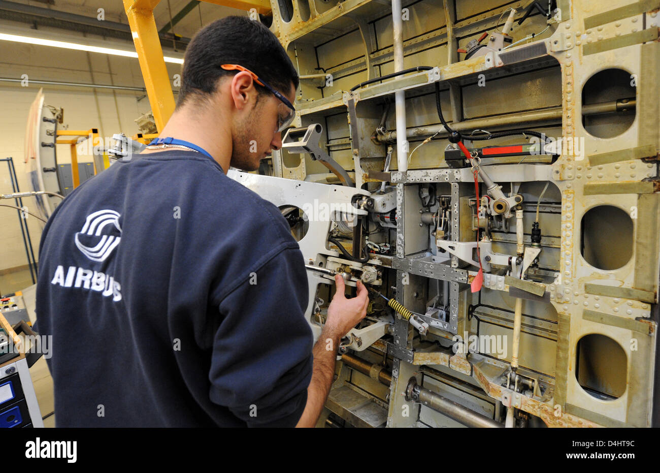 A member of staff of Airbus works at the company site in Hamburg ...