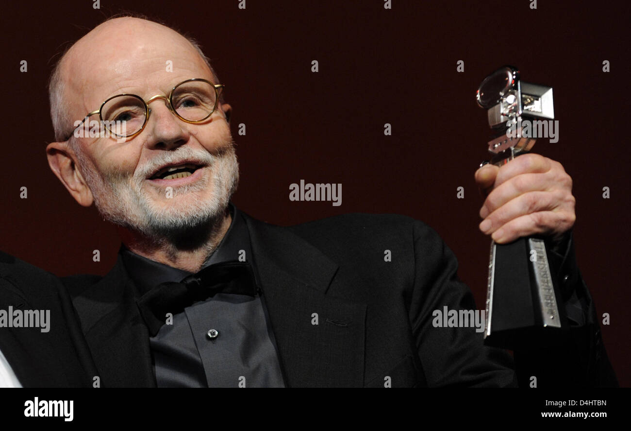 German producer Guenter Rohrbach holds his ?Berlinale Camera? at the ...