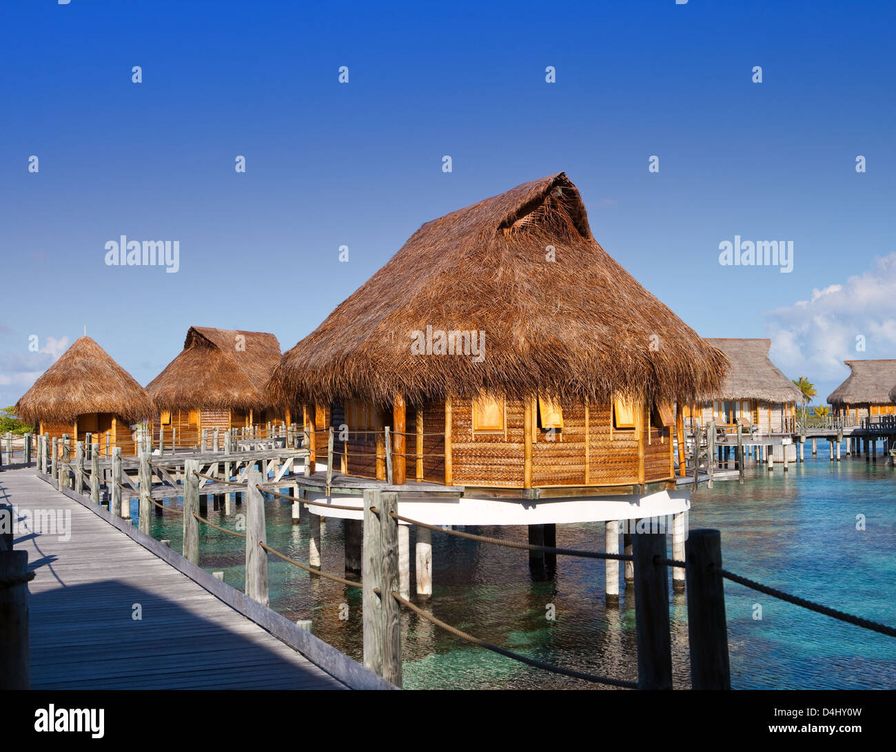 Typical Polynesian landscape -small houses on water Stock Photo - Alamy