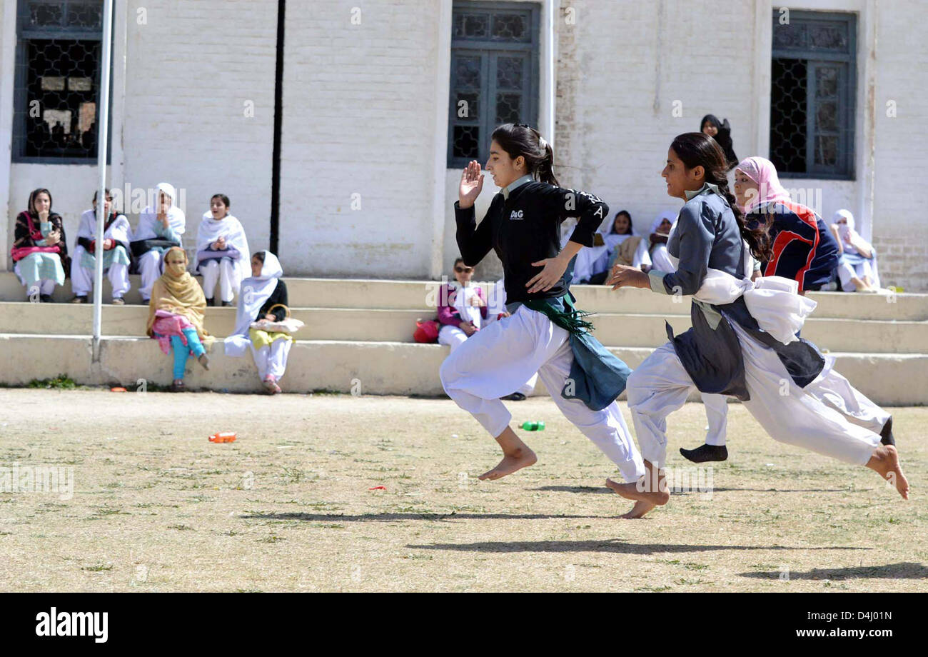 Students participate in a race competition during Sport Day arranged by ...