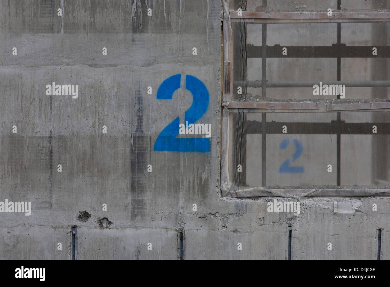 The number 2 stencilled for the second storey of a lift shaft being ...