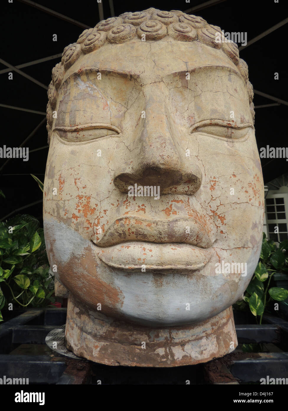 ASIATIC FACE sculptures outside a Singapore restaurant. Photo Tony Gale ...