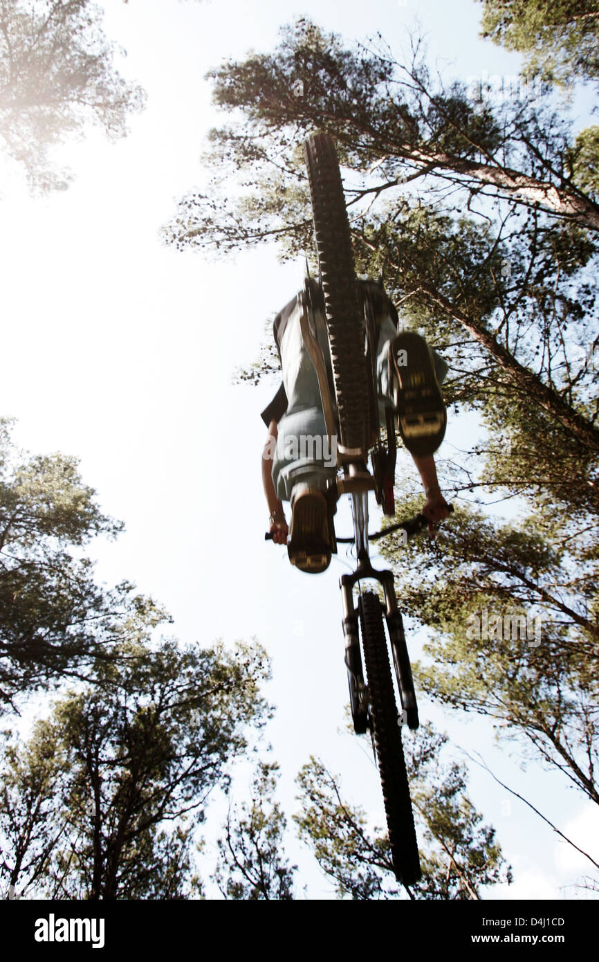 Caucasian male mountain bike jumping and performing aerial hi-res stock ...