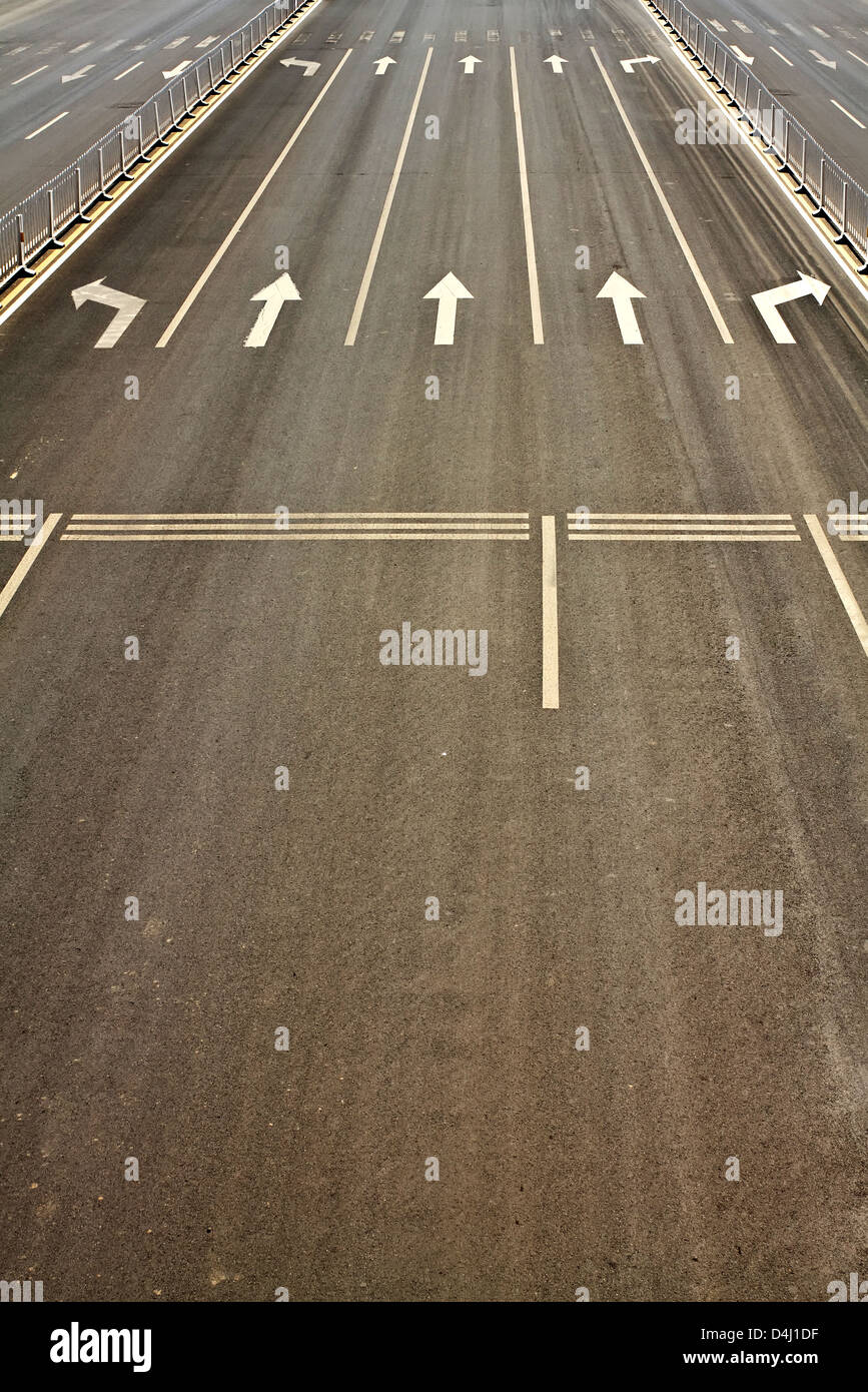 Details of wide street roads with traffic symbols Stock Photo - Alamy